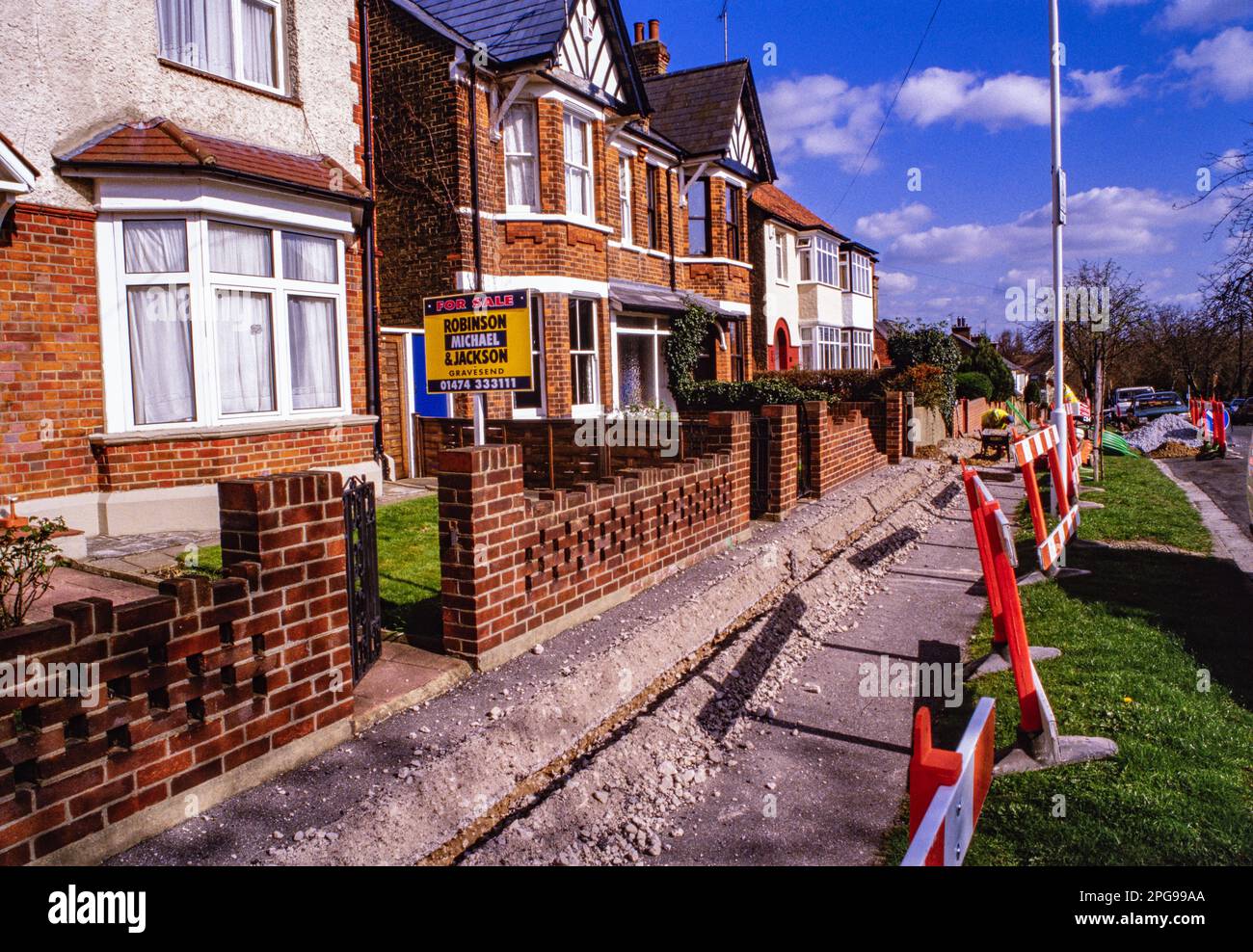 Cable TV and Internet infrastructure being installed in a suburban road ...