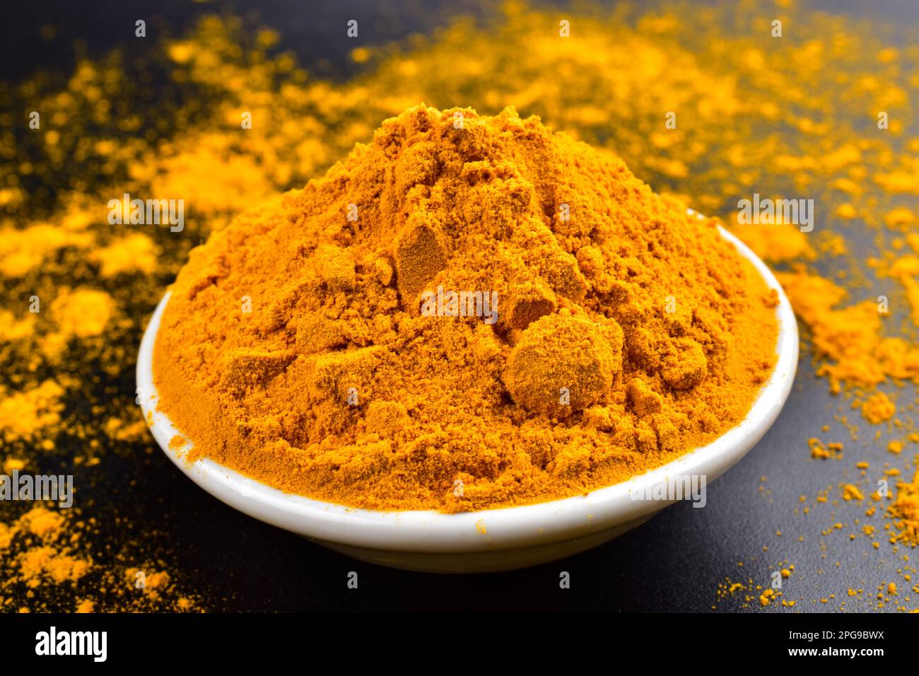 Fresh turmeric in bowl hi-res stock photography and images - Alamy