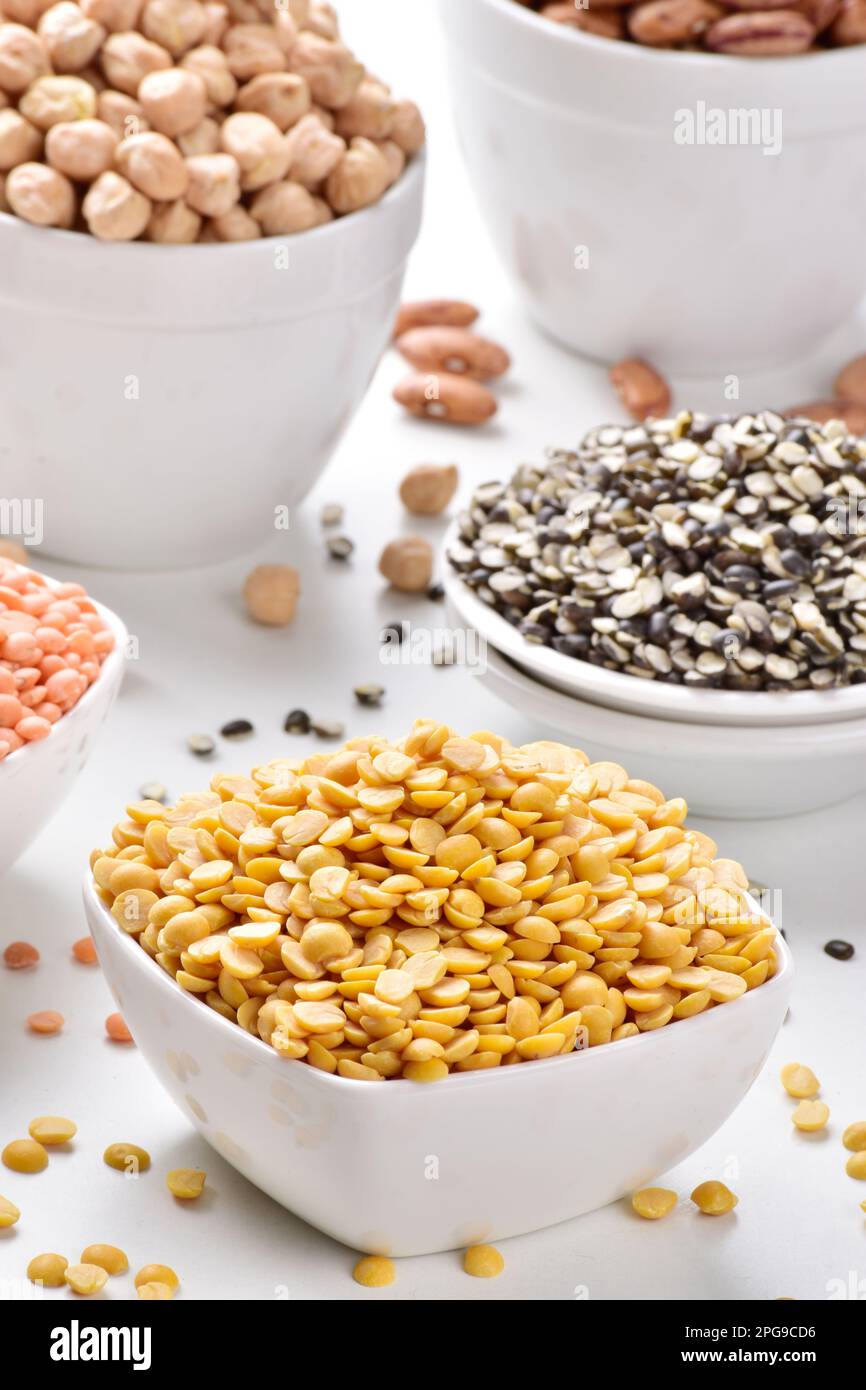 Raw chana dhal in bowl with multiple legume on white background Stock ...