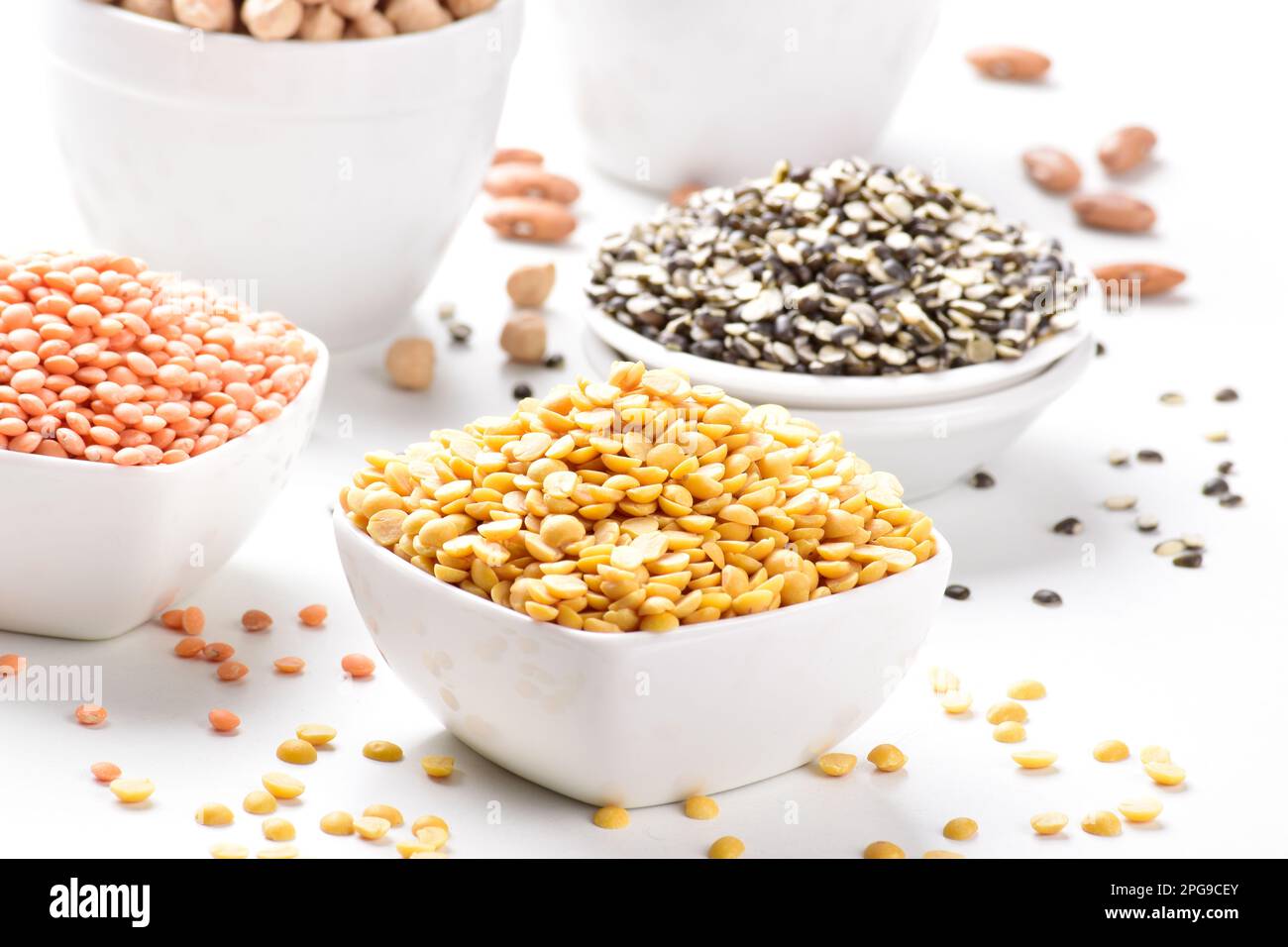 Uncooked yellow legume on bowl isolated on white background Stock Photo ...