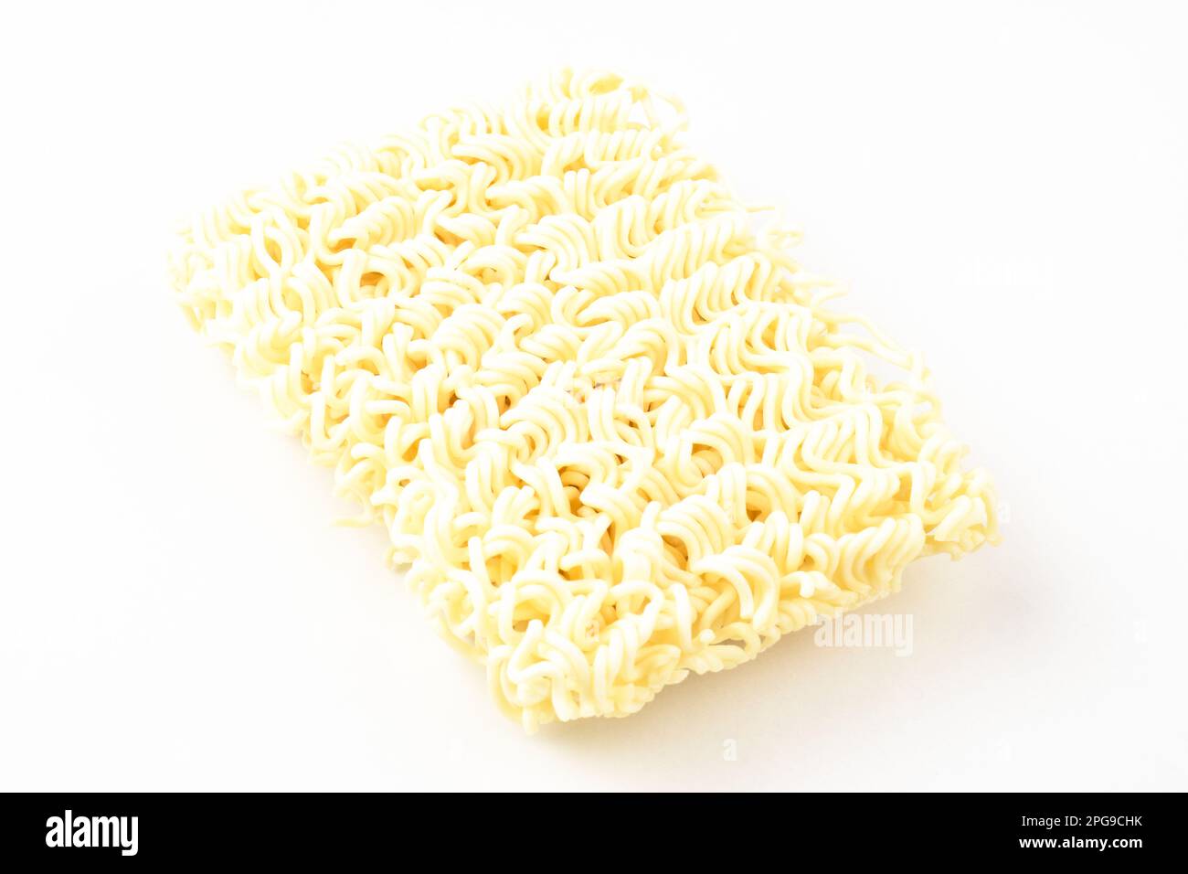 Uncooked square shaped noodles on white background Stock Photo - Alamy