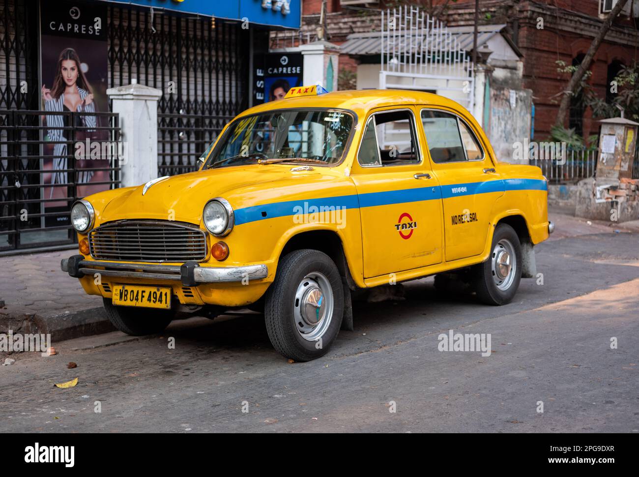 An Ambassador yellow cab parked in a street in Kolkata, India Stock ...
