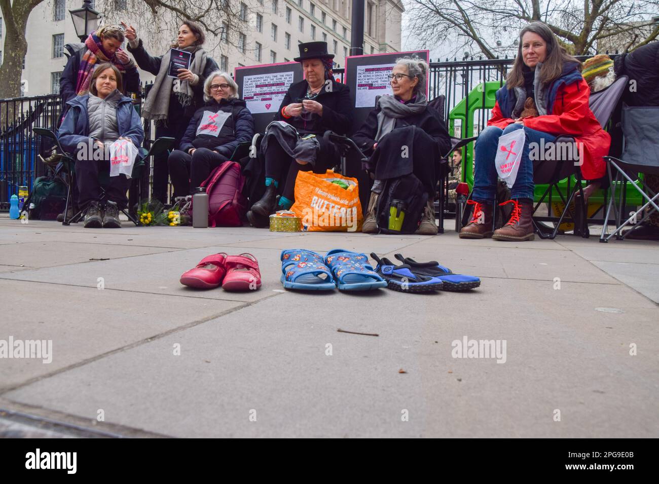 London, UK. 21st Mar, 2023. Children's shoes are seen during the hunger ...