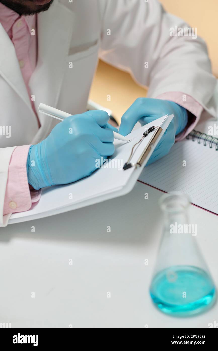 Gloved hand clinician making hi-res stock photography and images - Alamy