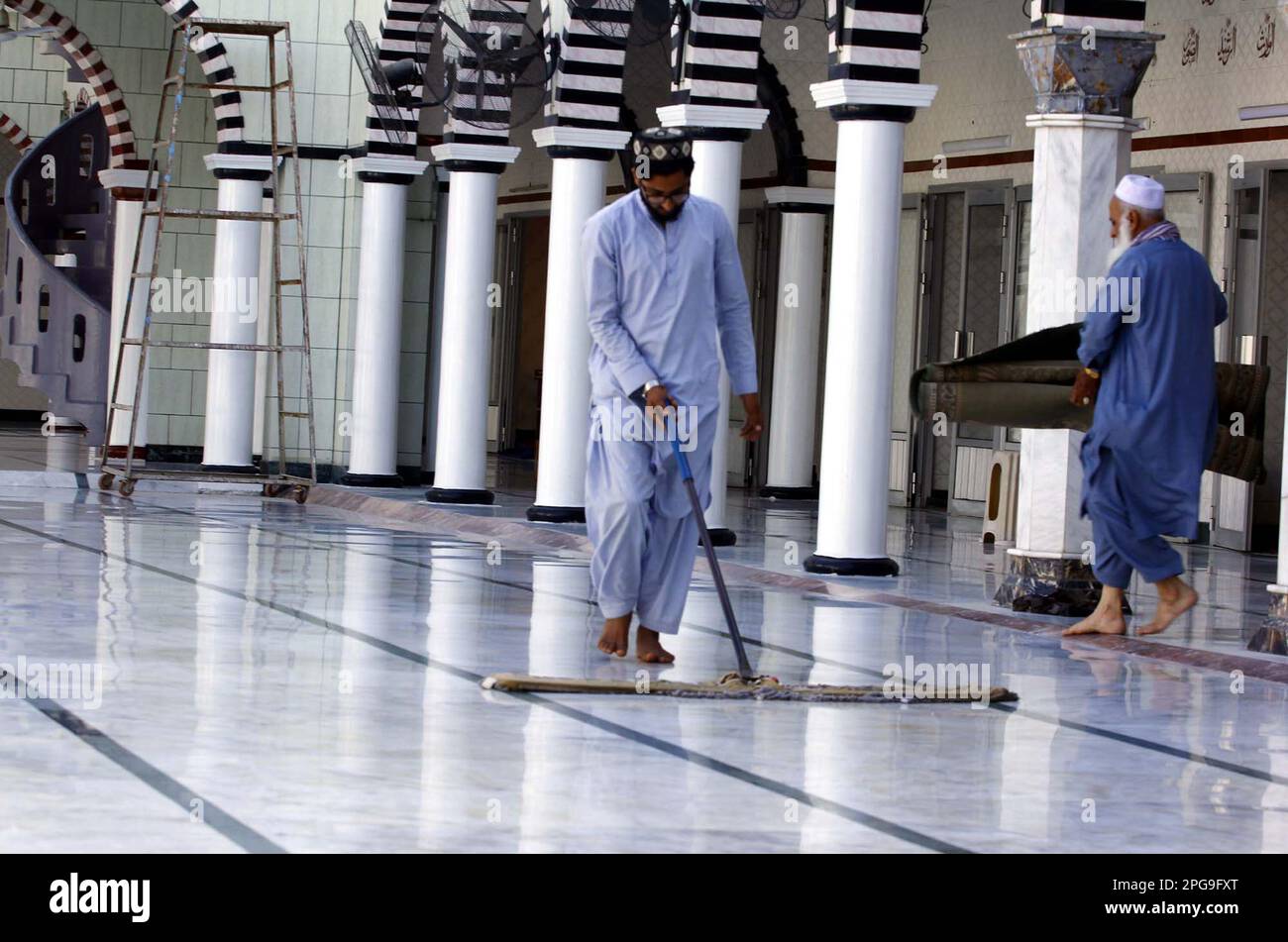 Faithful Muslim are cleaning the floors of Khizra Mosque during ...