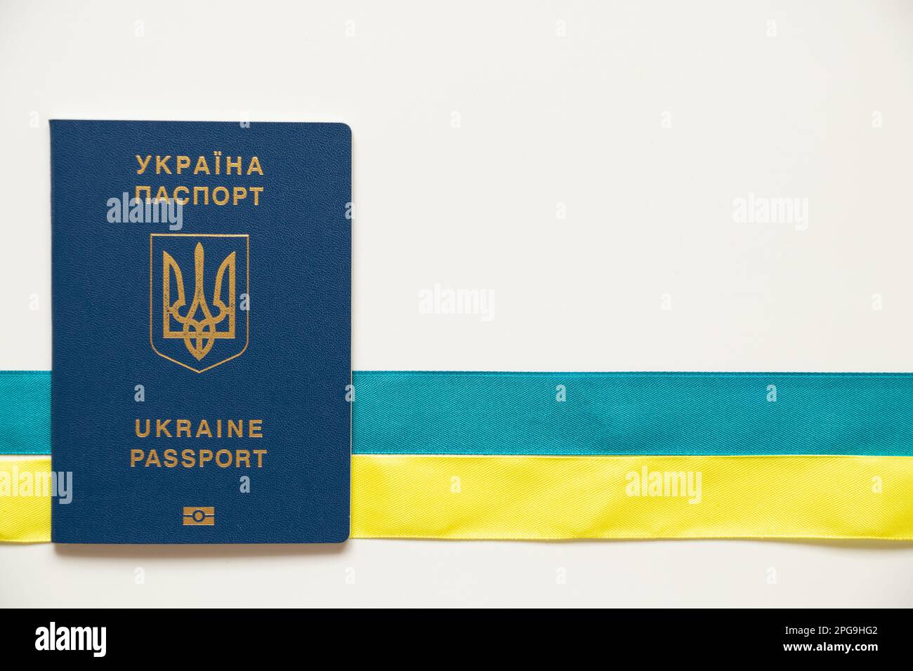 Foreign biometric passport and tape lie horizontally in the colors of ...