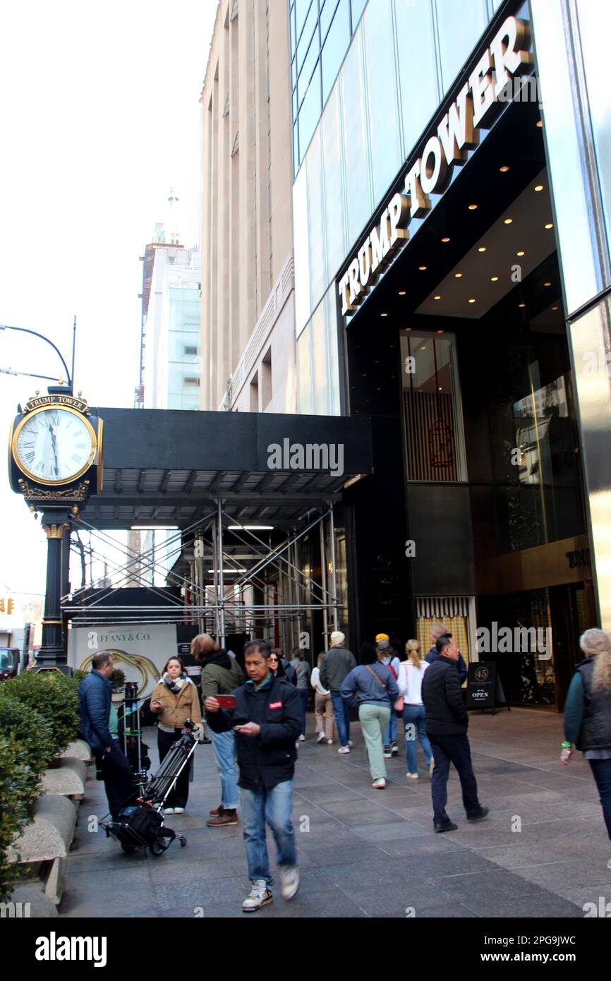 New York, USA. 21st Mar, 2023. Passersby walk along in front of Trump ...