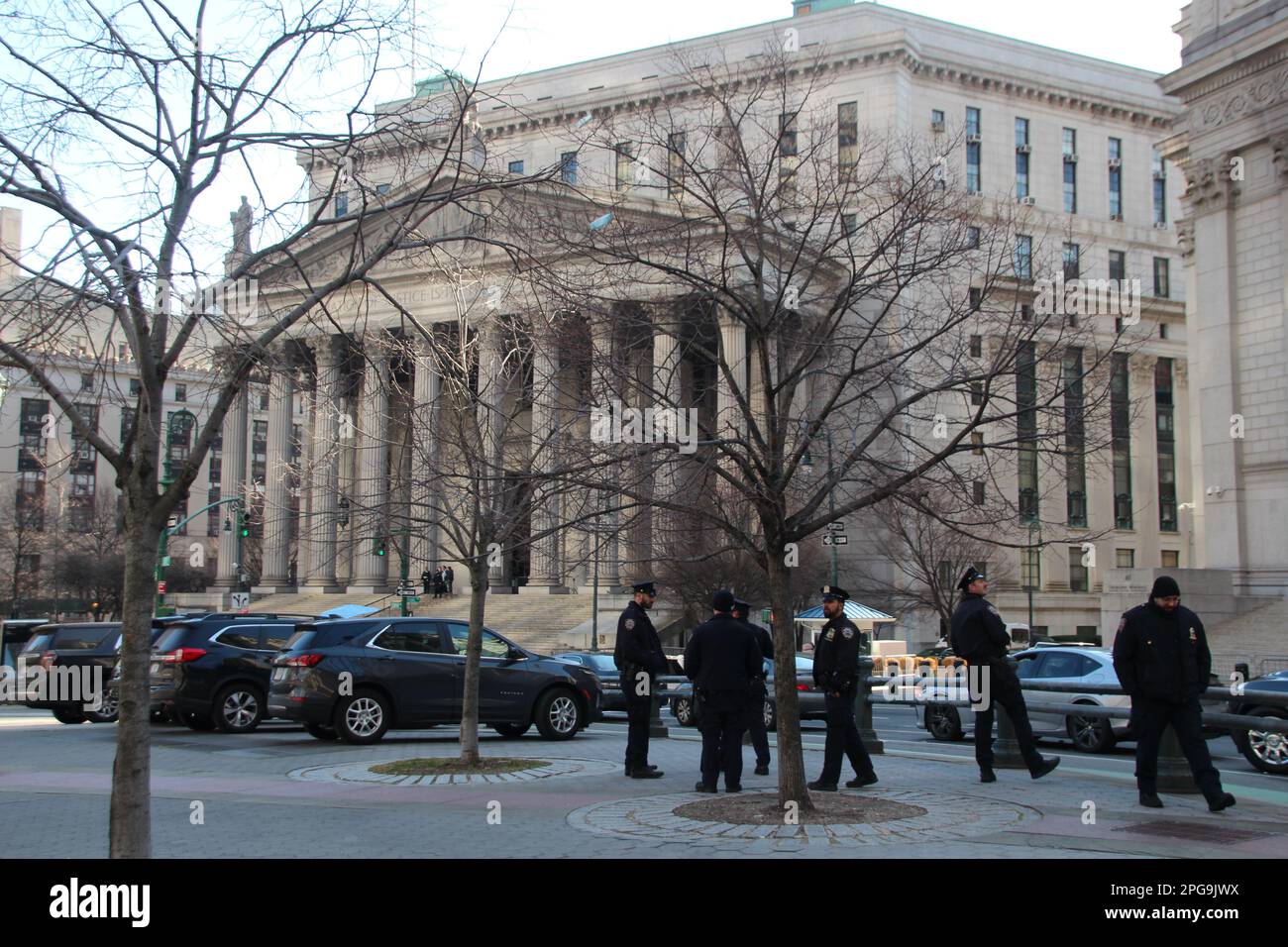 New York, USA. 21st Mar, 2023. Police officers wait outside the ...