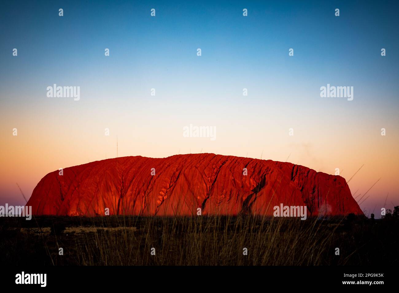 Uluru at sunset Stock Photo - Alamy