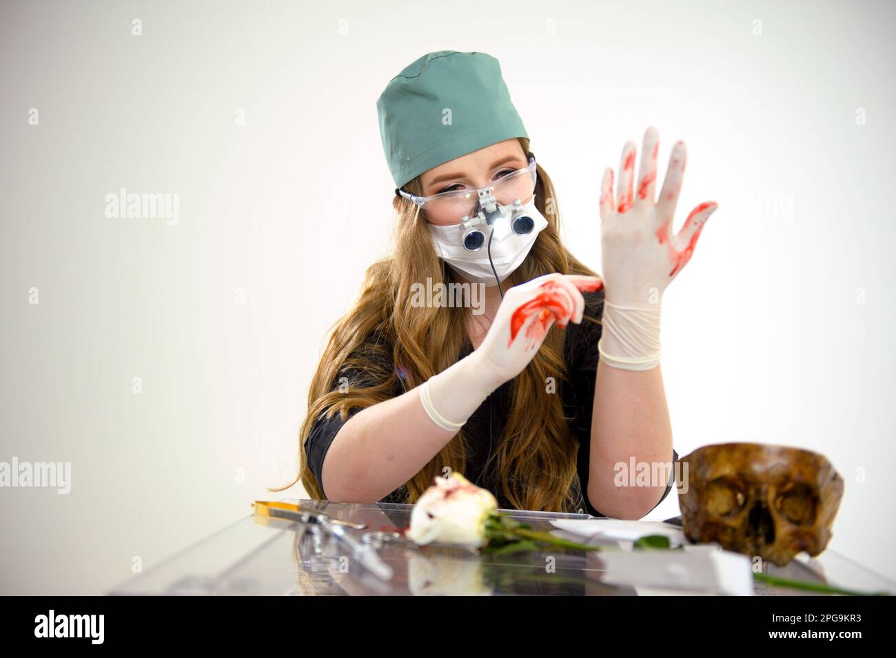 Hand in latex gloves with blood. The bloody hand isolated on white ...