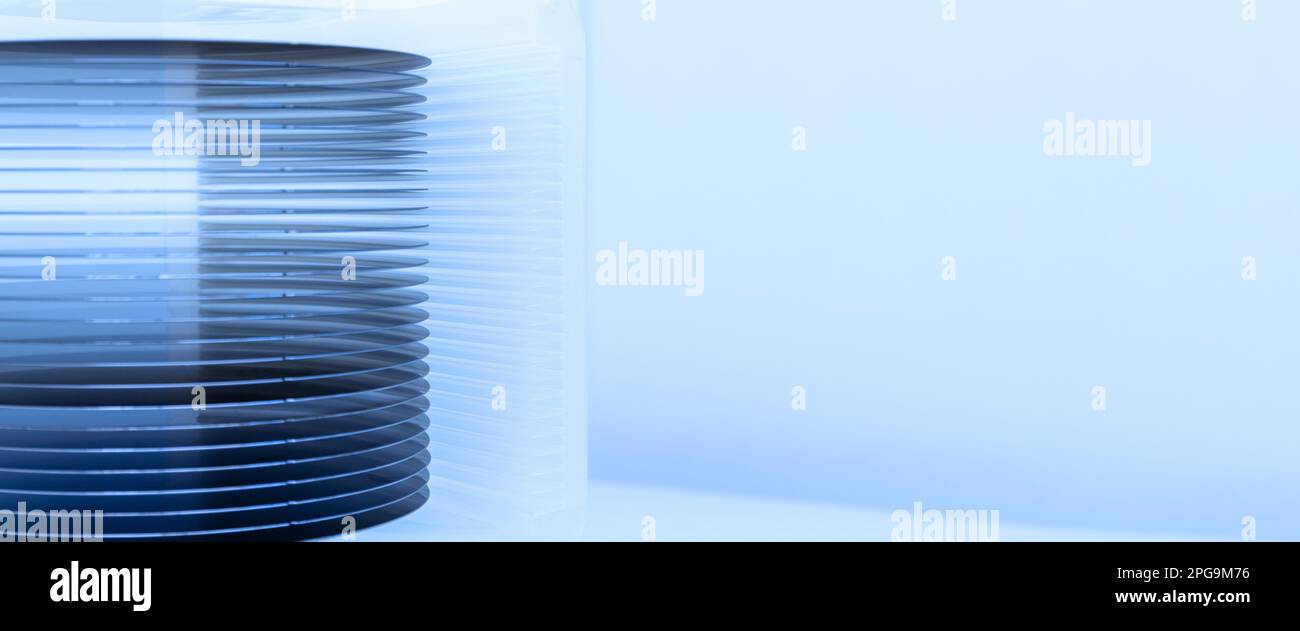 A batch of silicon wafers packed in a plastic storage box in the clean ...