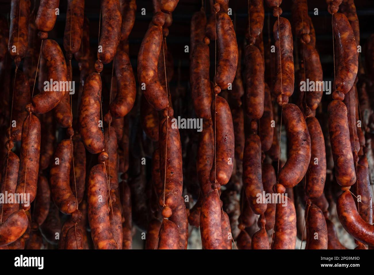 Delicious traditional spanish chorizos curing, homemade smoked pork ...
