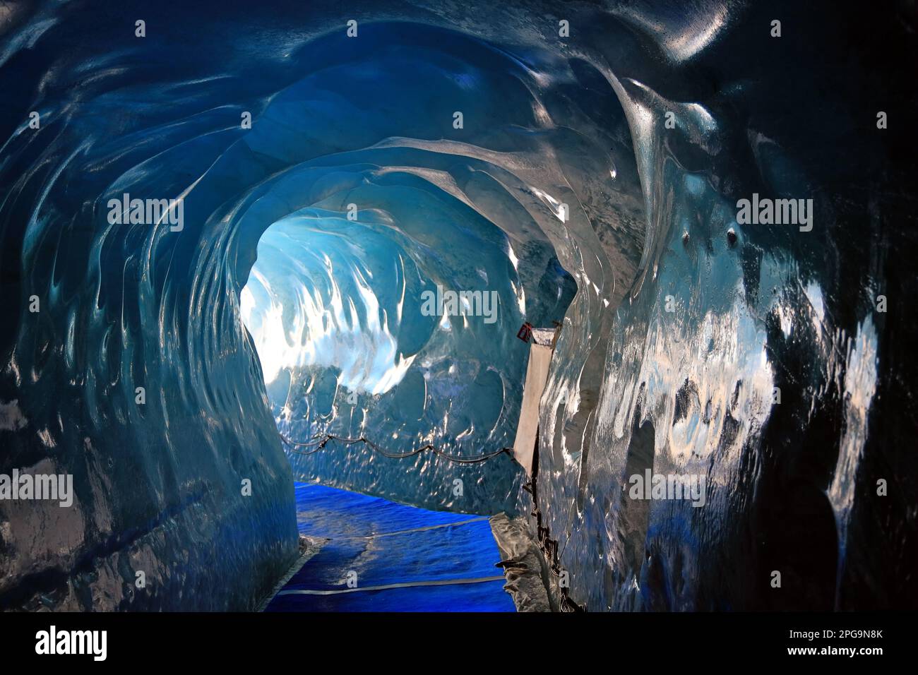 Ice cave in the glacier Mer de Glace ("Sea of Ice"). Mont Blanc massif ...
