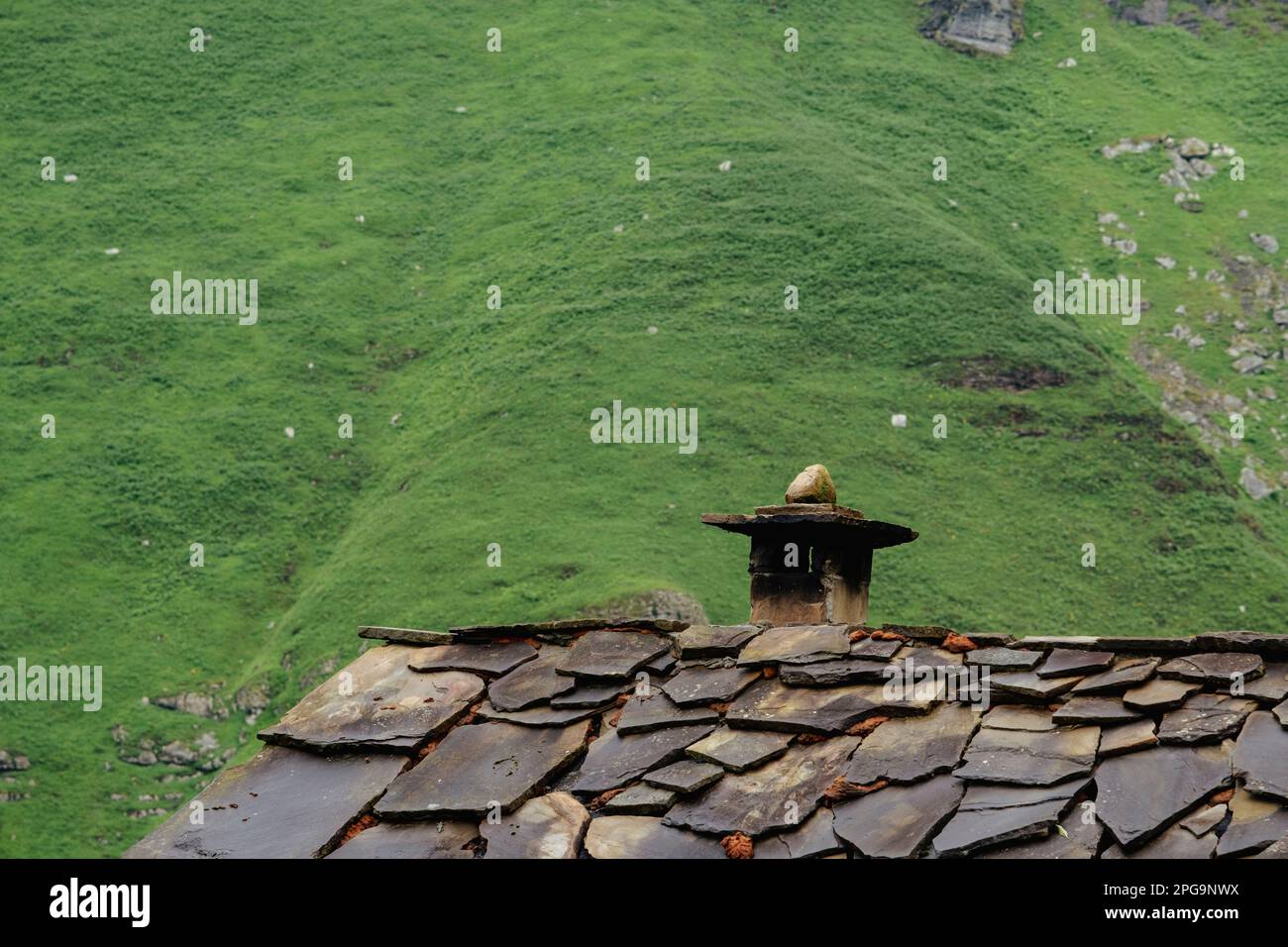 Traditional slate roof and chimney of a rustic traditional cabin in the ...