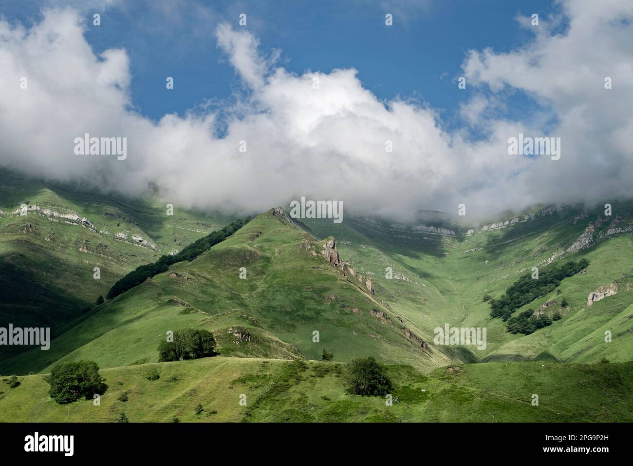 Rough mountain landscape with green steep limestone slopes in Valles ...