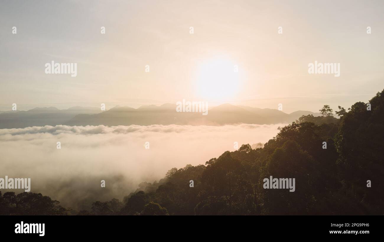 Sea clouds during golden sunrise above the Titiwangsa range mountains ...