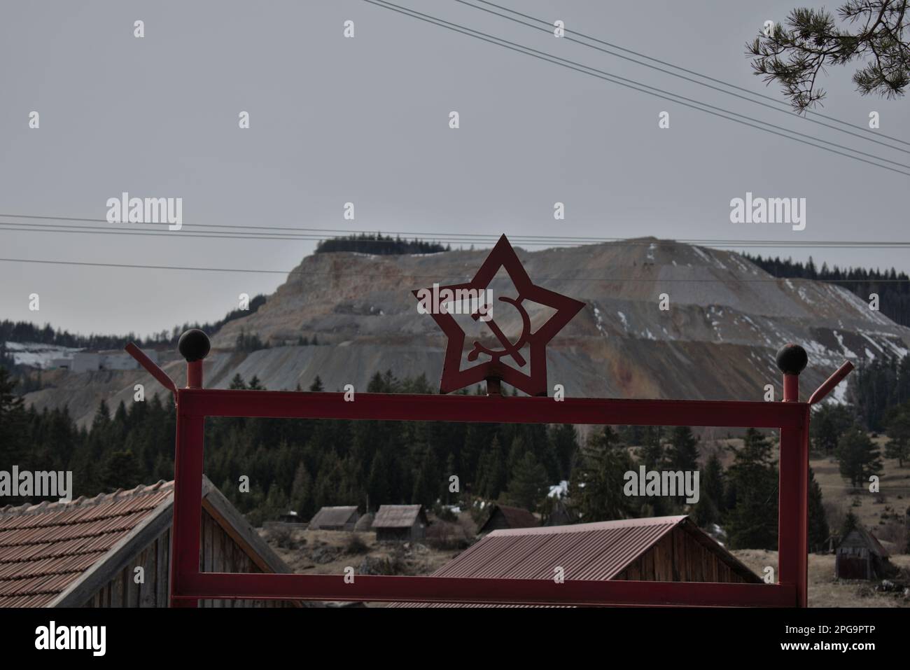 Symbol of communism and a lead and zinc mine Stock Photo - Alamy