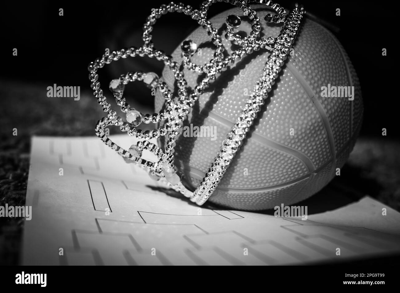 Basketball, tiara, and blank bracket signifying a Cinderella season ...