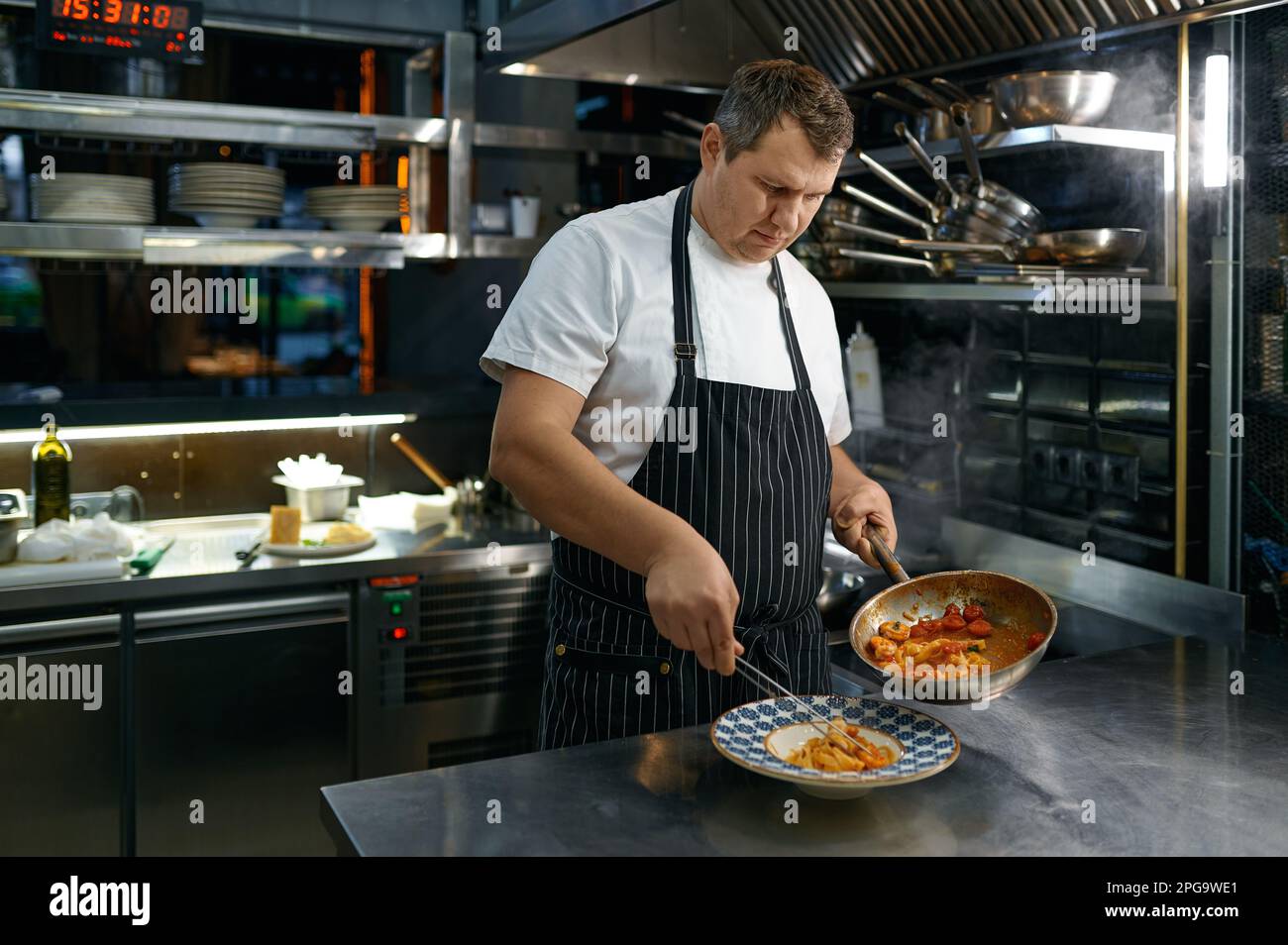 Chef putting delicious spaghetti hi-res stock photography and images ...