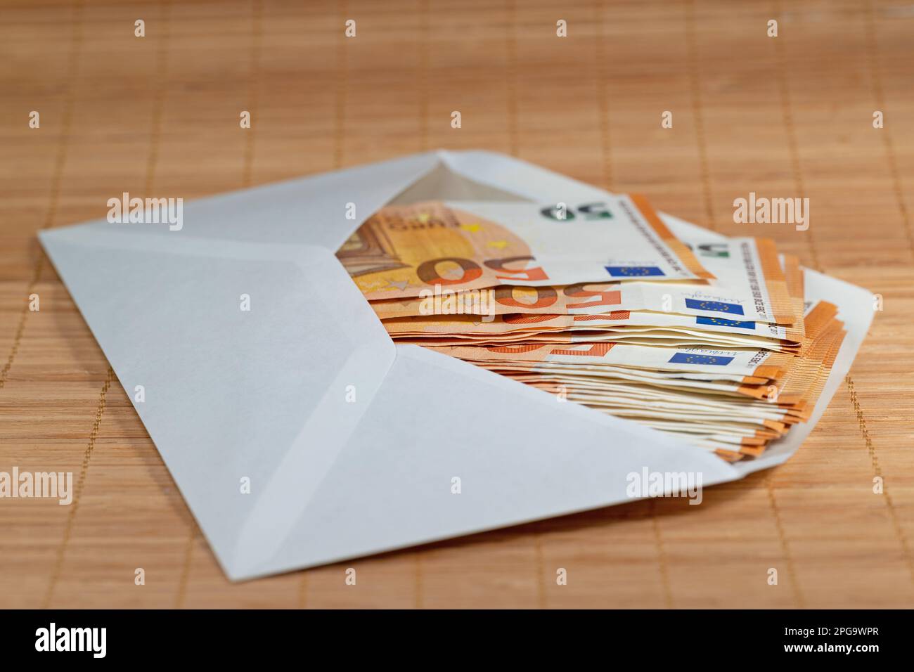Banknotes in an envelope, close-up Stock Photo - Alamy