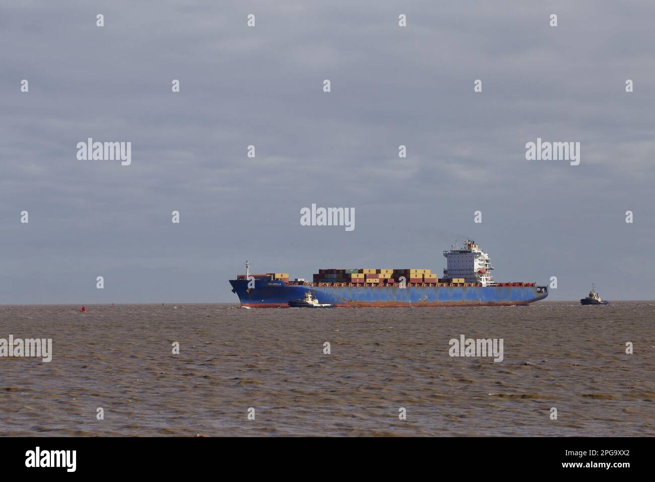 Container ship MSC Mirella entering the Port of Felixstowe assisted by ...