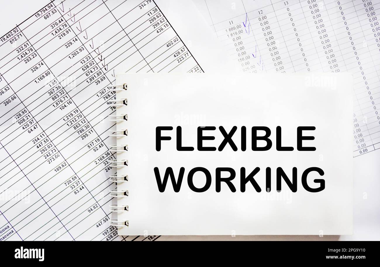 FLEXIBLE WORKING text in office notepad with documents, business Stock ...