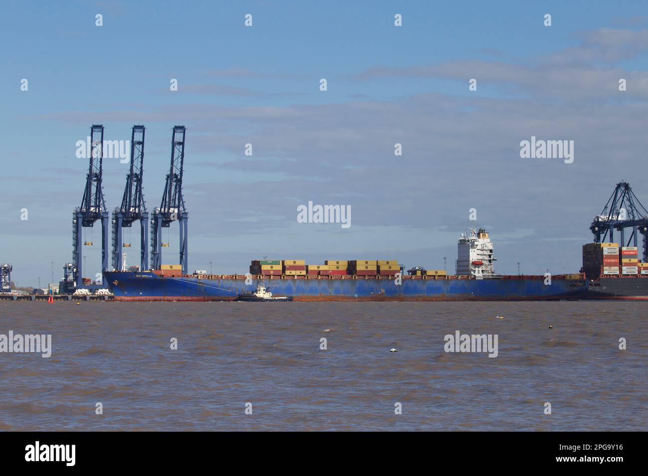 Container ship MSC Mirella entering the Port of Felixstowe assisted by ...