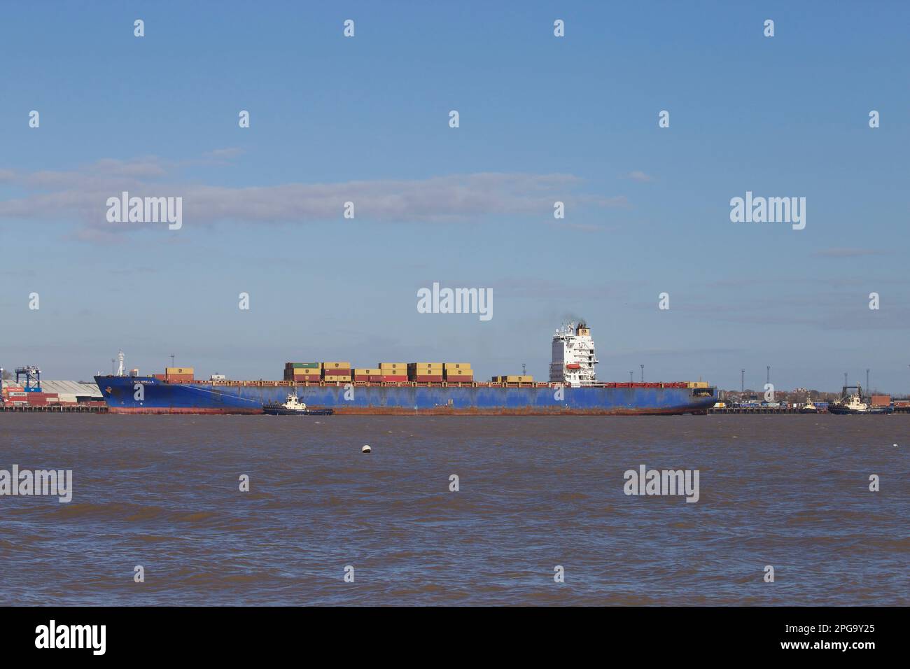 Container ship MSC Mirella entering the Port of Felixstowe assisted by ...