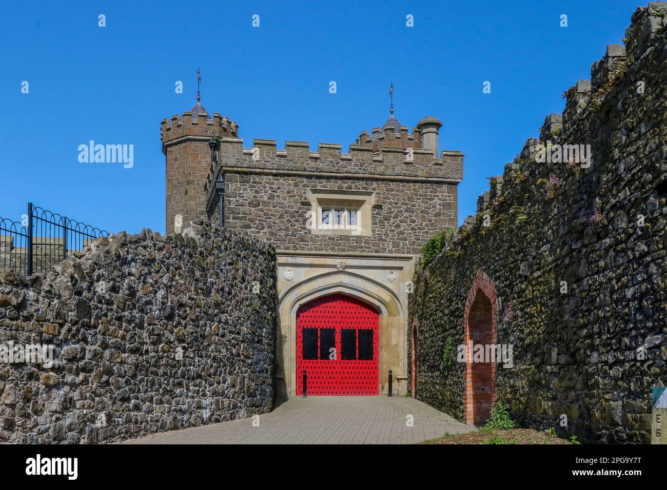 Old town walls to Barbican Gate Lodge a neo-Tudor building with twin ...