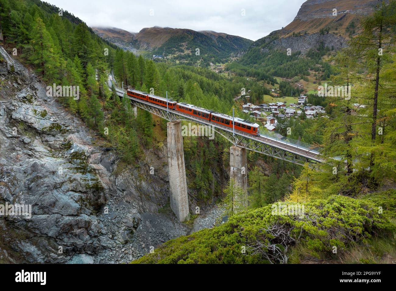 Zermatt, Switzerland Gornergrat red tourist train on the bridge ...