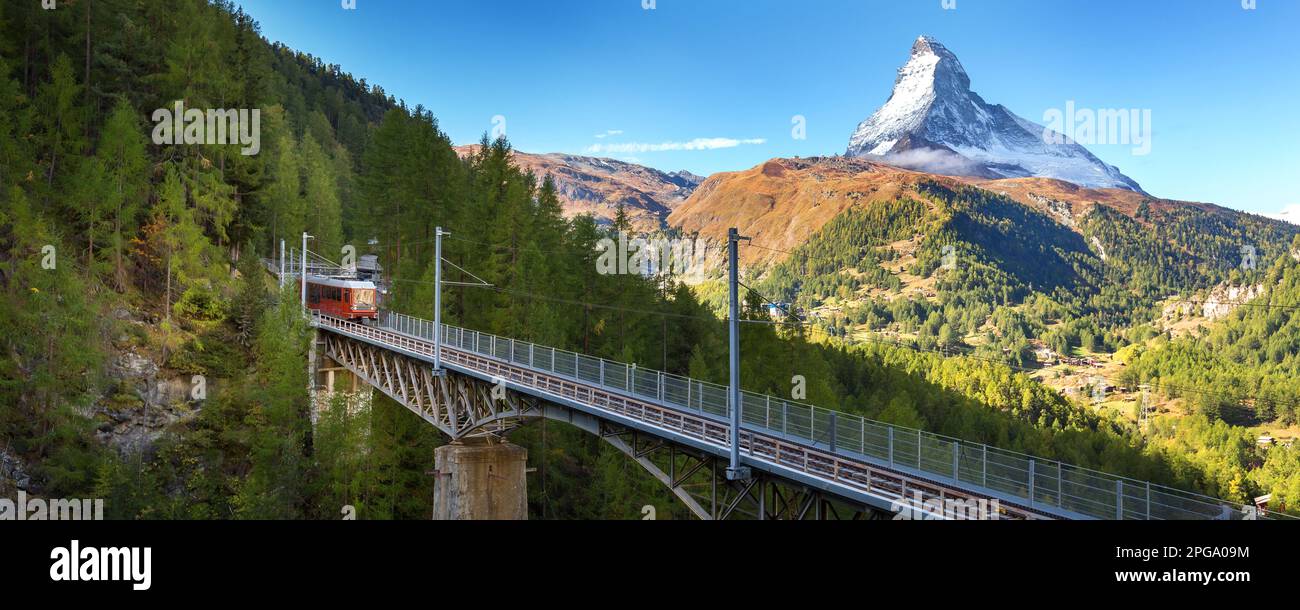 Zermatt, Switzerland. Gornergrat red tourist train on the bridge and ...