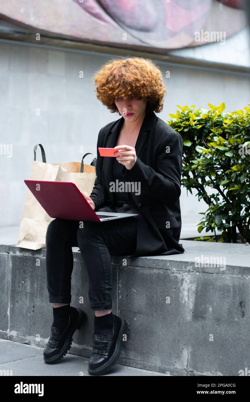 a non-binary person making sure about the card information Stock Photo ... a non-binary person making sure about the card information Stock Photo ...
