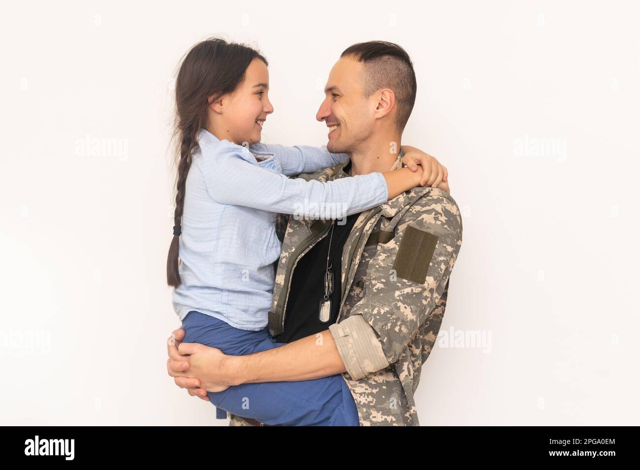 pretty little girl hugging her military father Stock Photo - Alamy