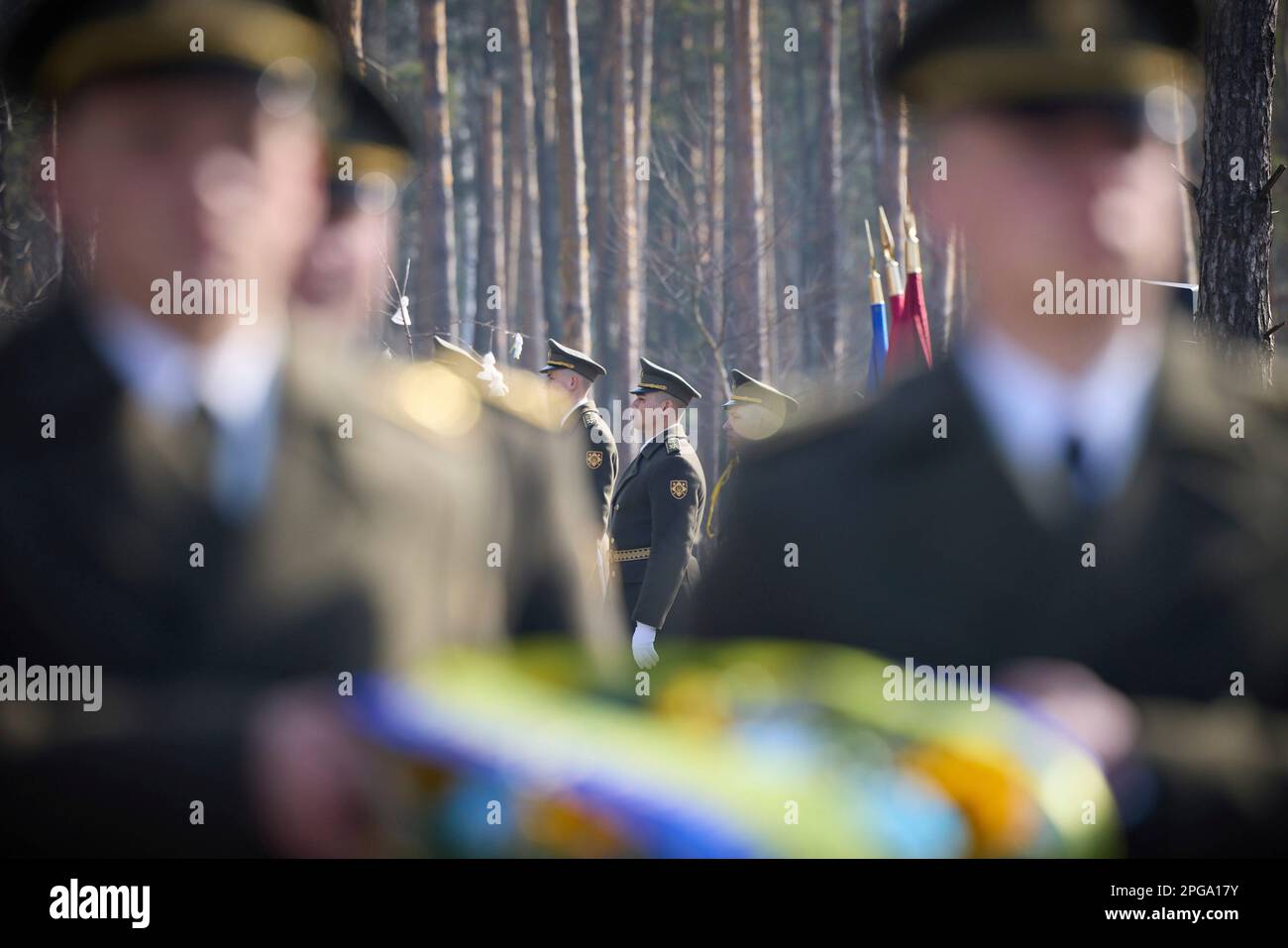 Moschun, Ukraine. 21st Mar, 2023. Ukrainian honor guards stand at ...