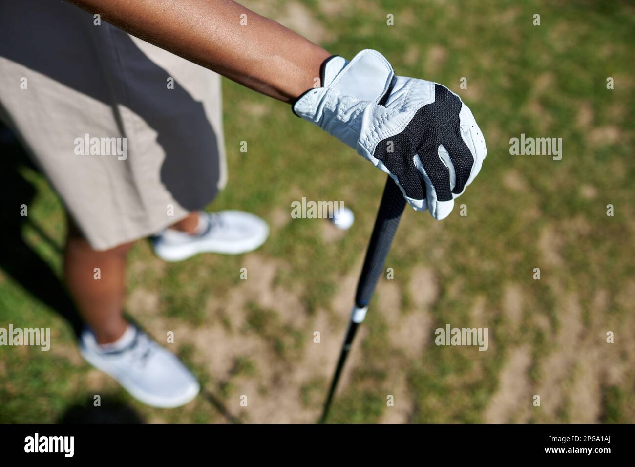 Top view closeup of gloved female hand holding golf club outdoors ...