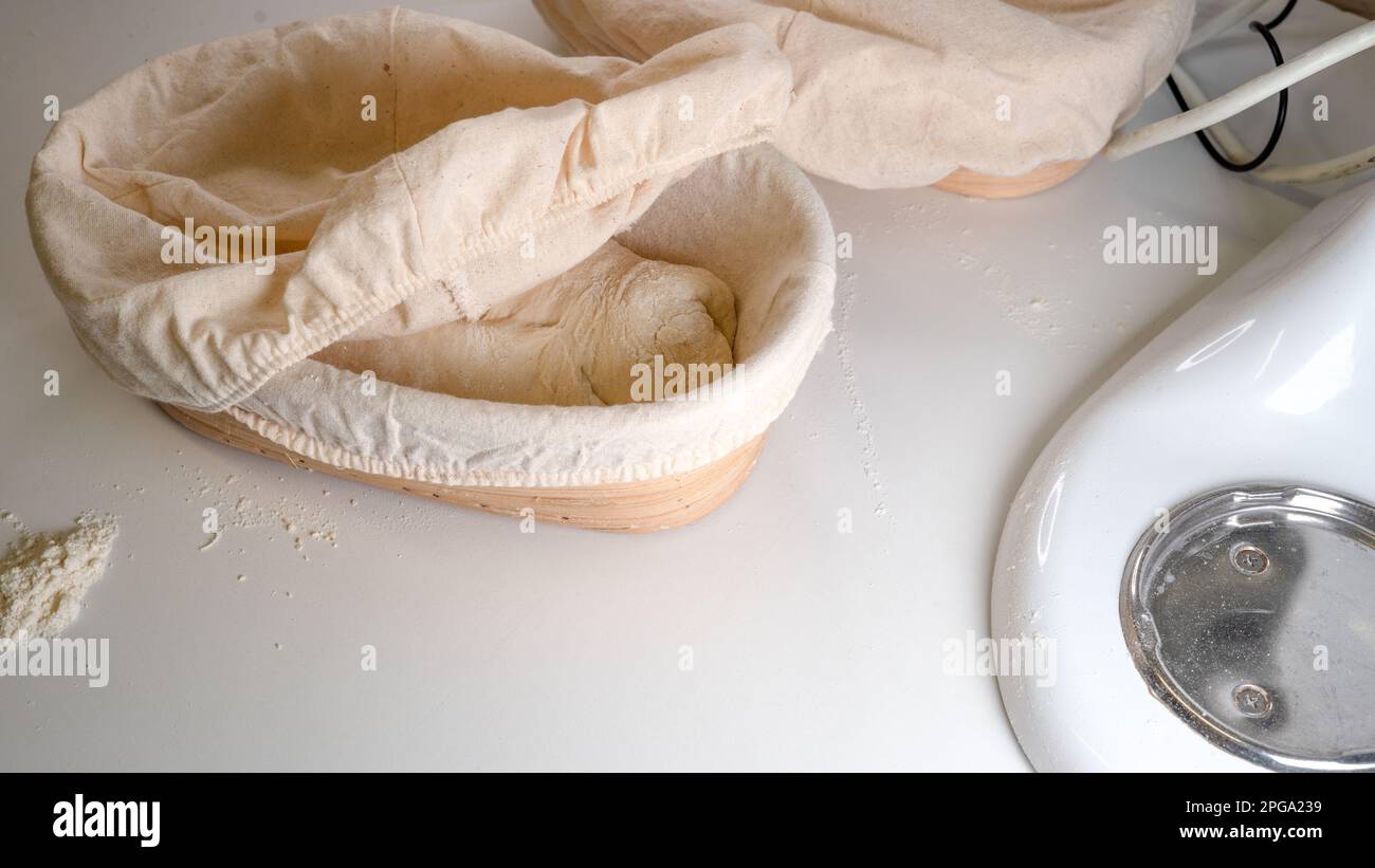 Proofing basket, bannetons bread score on white table, sourdough bread ...