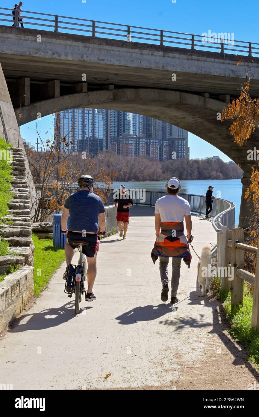 Austin, Texas, USA - February 2023: People walking and cycling on the ...