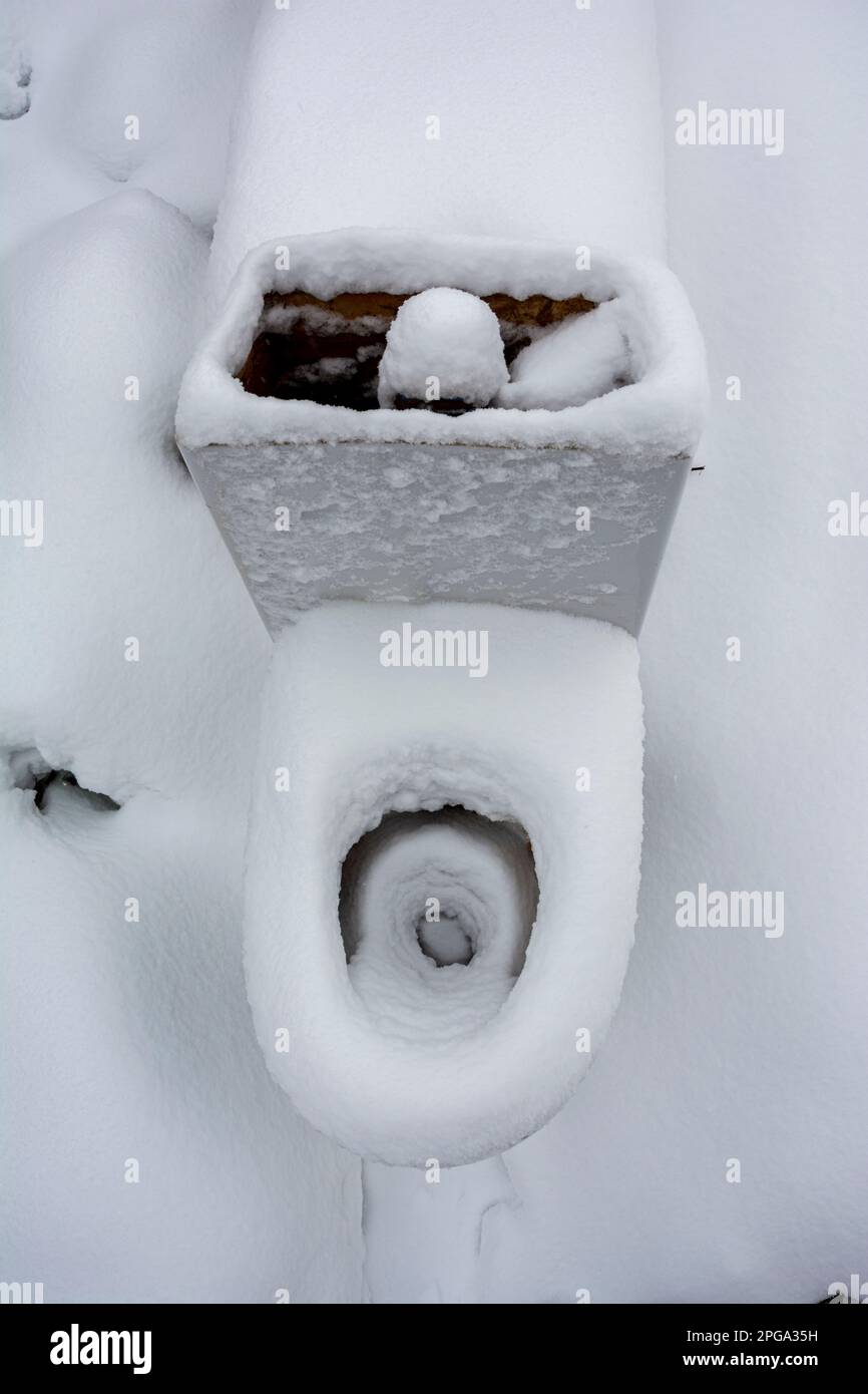 an old disassembled toilet bowl standing on the ground Stock Photo - Alamy