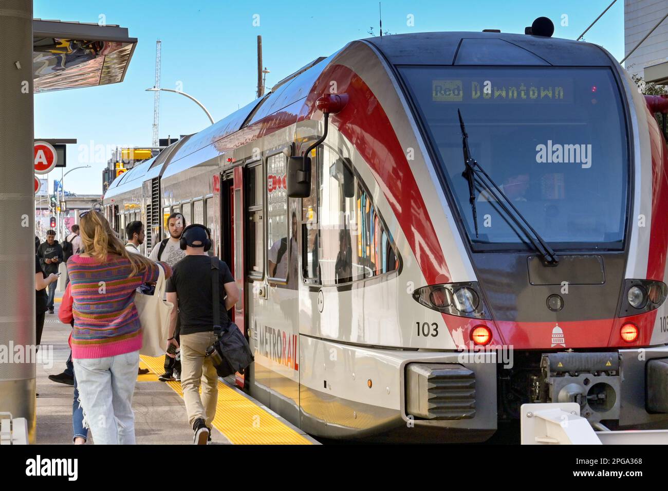 Austin, Texas, USA - February 2023: people getting off a commuter train ...