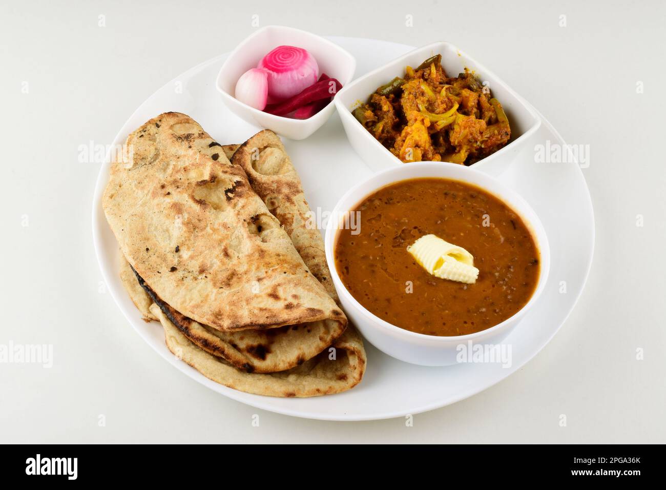 Indian food in plate isolated on white background, dal roti sabji Stock ...