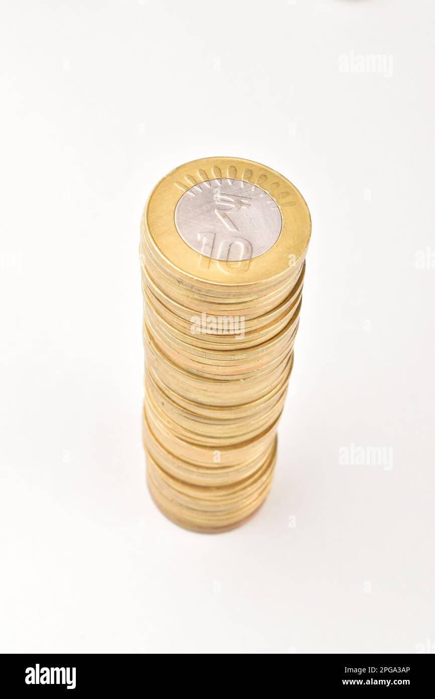 Closeup of coin stack isolated on white background, indian rupee coin ...