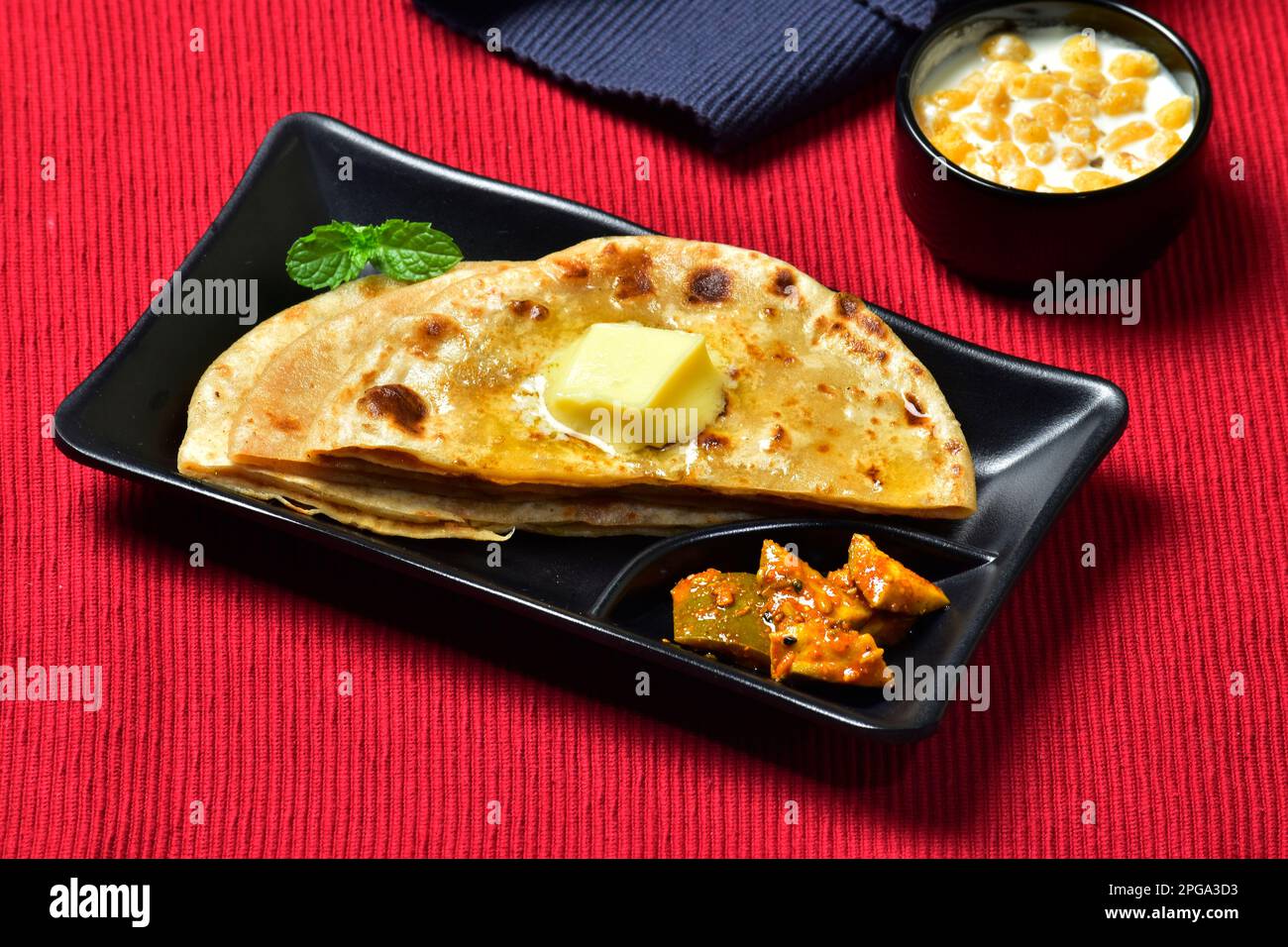 Butter paratha with achar in plate, healthy indian breakfast Stock ...