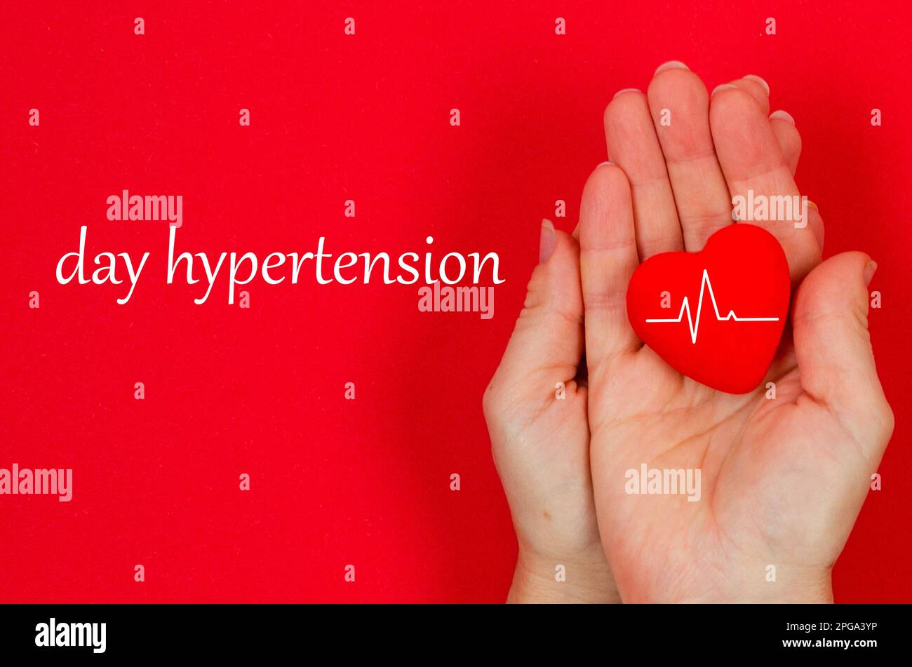 Red heart in woman hands - symbol of high blood pressure. Heart health ...