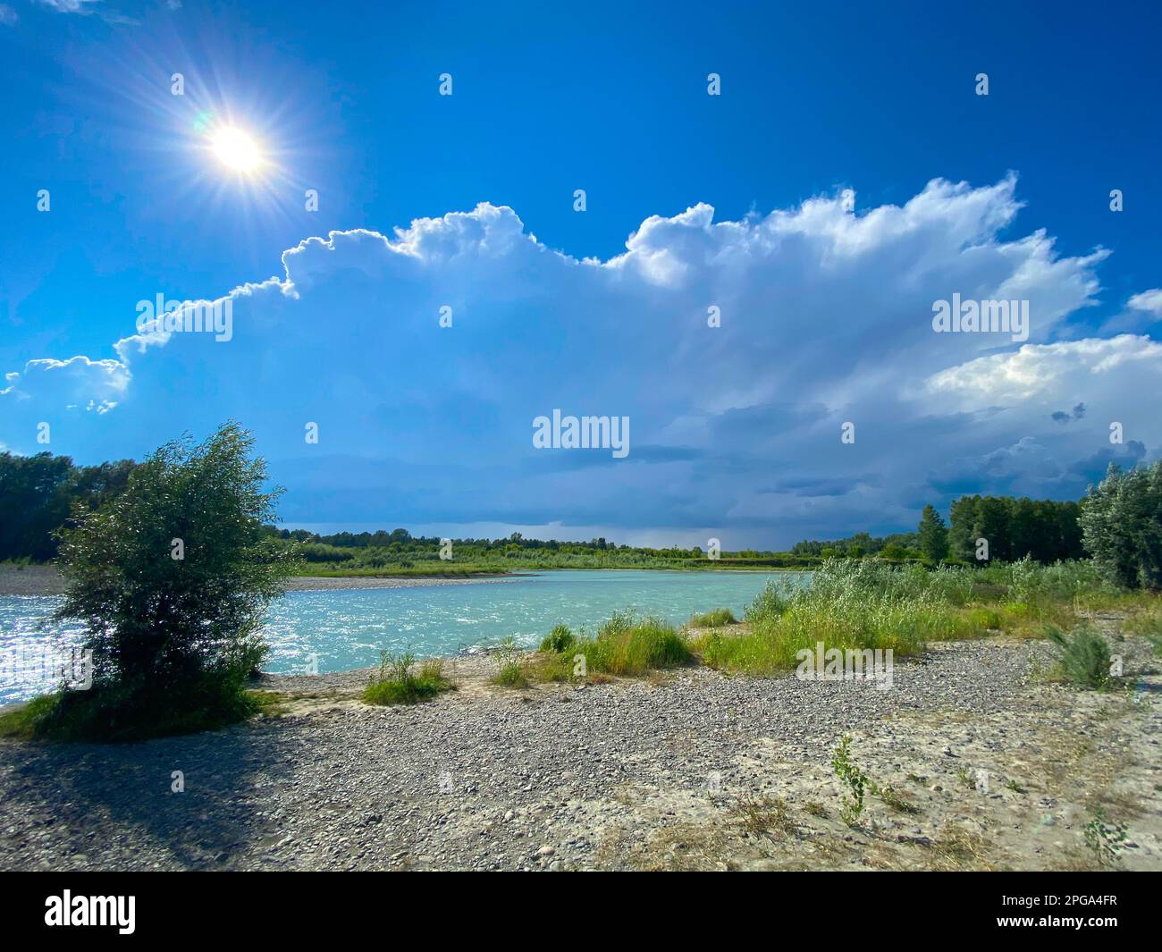 The road to the sandy-stone beach of the turquoise mountain river Katun ...