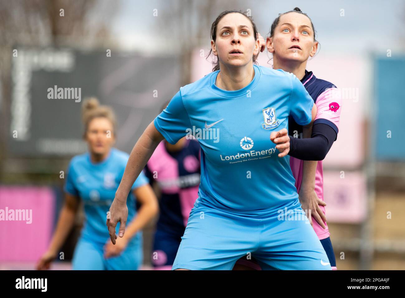 Female footballers in action Stock Photo - Alamy
