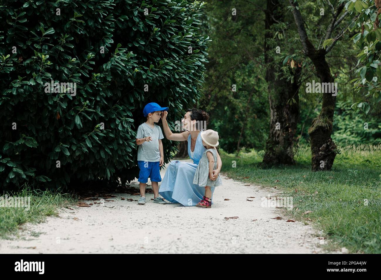 Mom communicates with two children hi-res stock photography and images ...