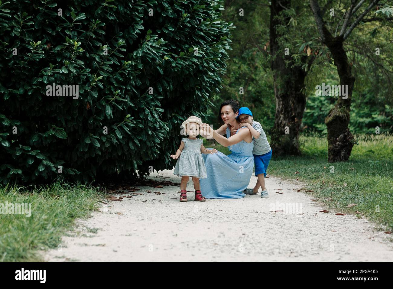 Mom communicates with two children hi-res stock photography and images ...