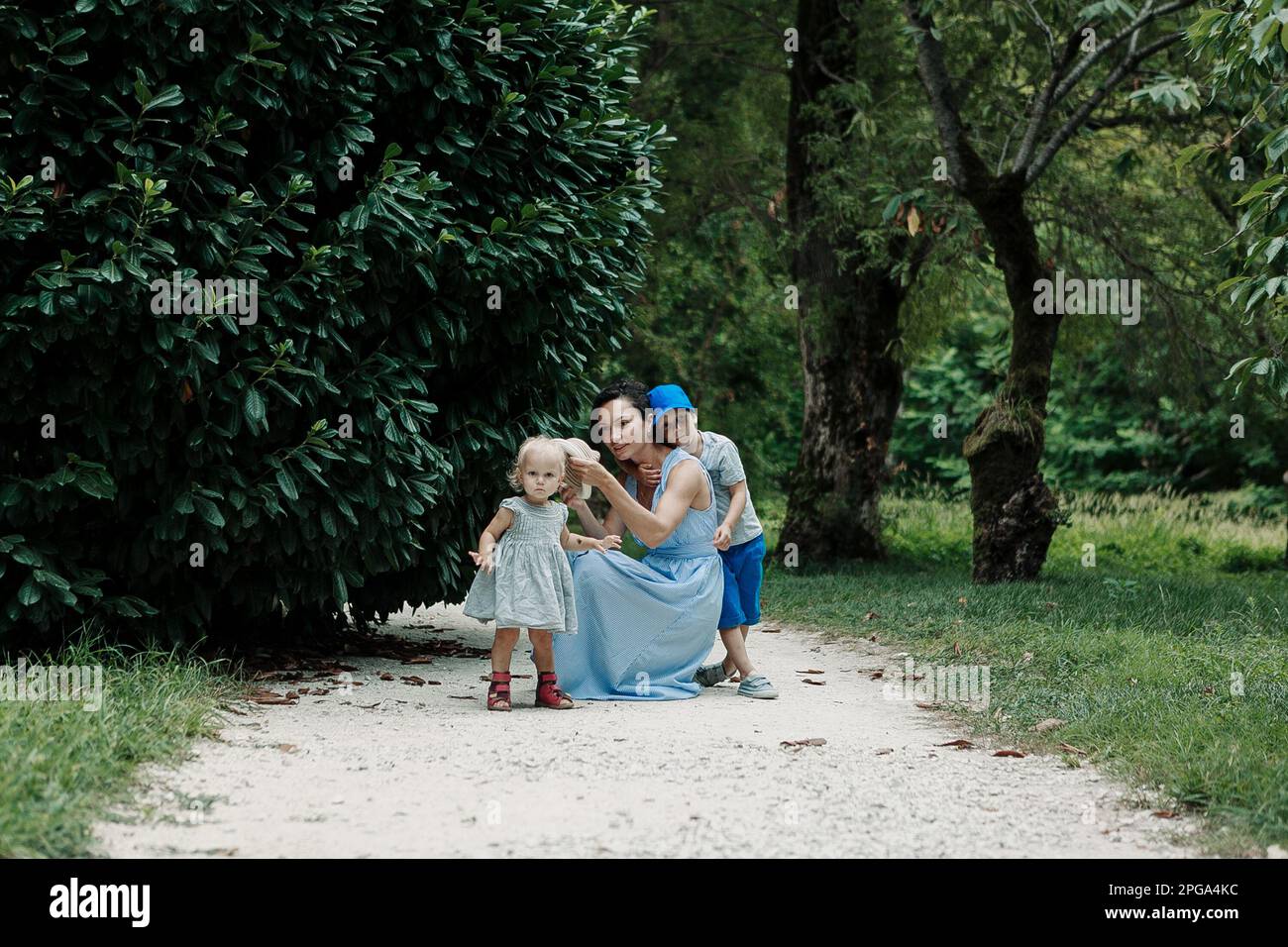 Mom communicates with two children hi-res stock photography and images ...