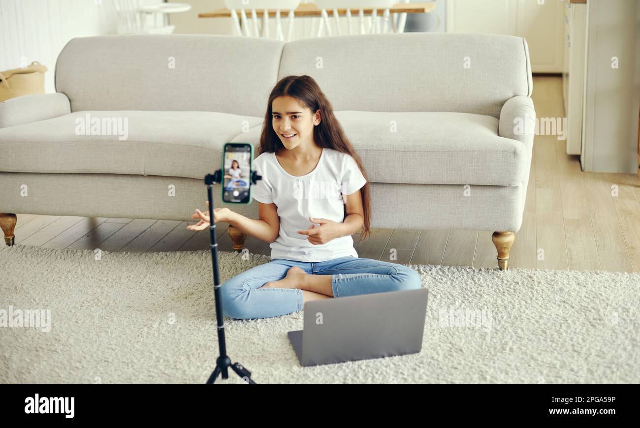 Beautiful preteen 12s girl blogger record video for vlog, talk to ...