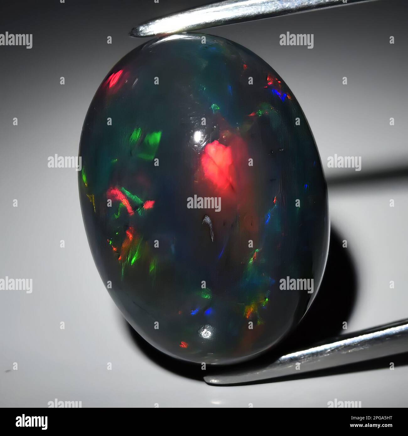 Natural precious stone opal on a black background Stock Photo - Alamy